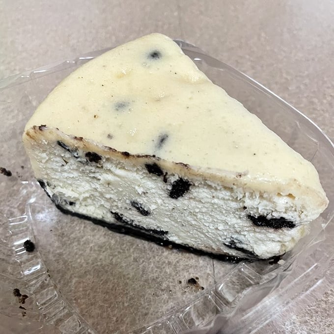 Oreo cheesecake: where childhood cookie memories meet grown-up dessert sophistication. The cookies aren't crushed&mdash;they've been promoted to a higher calling.