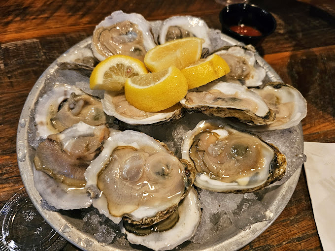 These oysters aren't just served; they're presented&mdash;glistening on ice like jewels, with lemon wedges standing by for that perfect squeeze of sunshine.