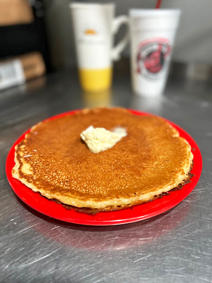 Pancakes so perfectly golden they make you wonder if the griddle is somehow connected to Fort Knox. That butter pat melts like your resolve.