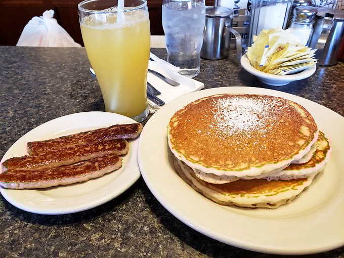 Pancake perfection isn't complicated&mdash;it's this golden stack with a side of sausage that makes you question why anyone needs avocado toast.