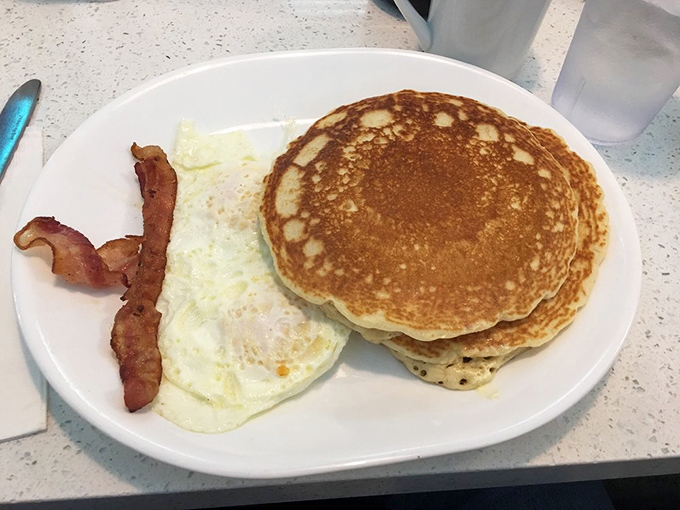 These pancakes aren't just breakfast, they're edible frisbees of joy &ndash; golden-brown on the outside, fluffy within, and large enough to require GPS.