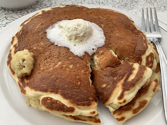 These pancakes aren't just breakfast&mdash;they're fluffy golden discs of joy with a melting pat of butter performing its final, glorious act.