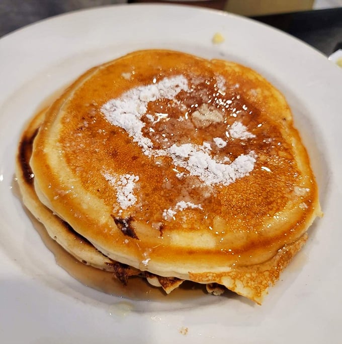 Golden pancakes dusted with powdered sugar&mdash;the breakfast equivalent of that perfect vinyl record that never skips, familiar yet somehow extraordinary.
