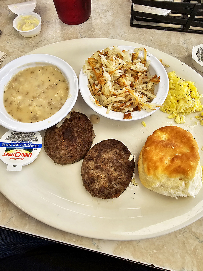 The breakfast that launched a thousand road trips. Golden hash browns, fluffy scrambled eggs, and a biscuit that could make your grandma question her recipe.