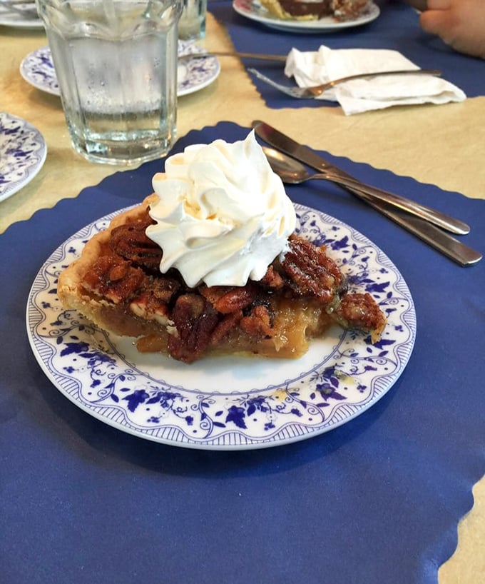 Pecan pie perfection with a cloud of whipped cream&mdash;this isn't just dessert, it's an edible work of art that would make Georgia pecan farmers weep with joy.