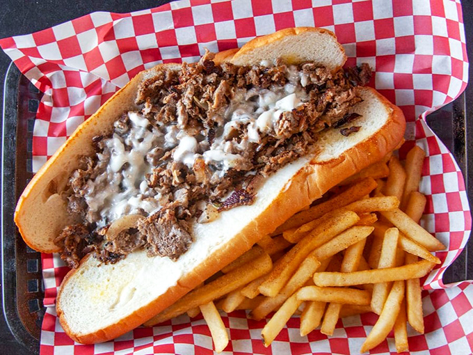 The Philly cheesesteak po'boy laughs at your diet plans. Those golden fries aren't just a side&mdash;they're co-conspirators in delicious indulgence.