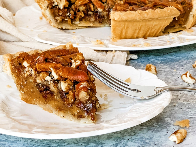 Fork meets pie in a romance for the ages. That golden filling and those perfectly arranged pecans are the Bogart and Bacall of desserts.