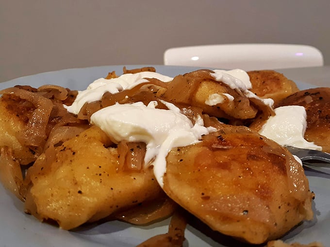 Pierogies that could start a religion&mdash;golden-brown pockets of potato perfection topped with caramelized onions and a dollop of sour cream that whispers, "Diet tomorrow."