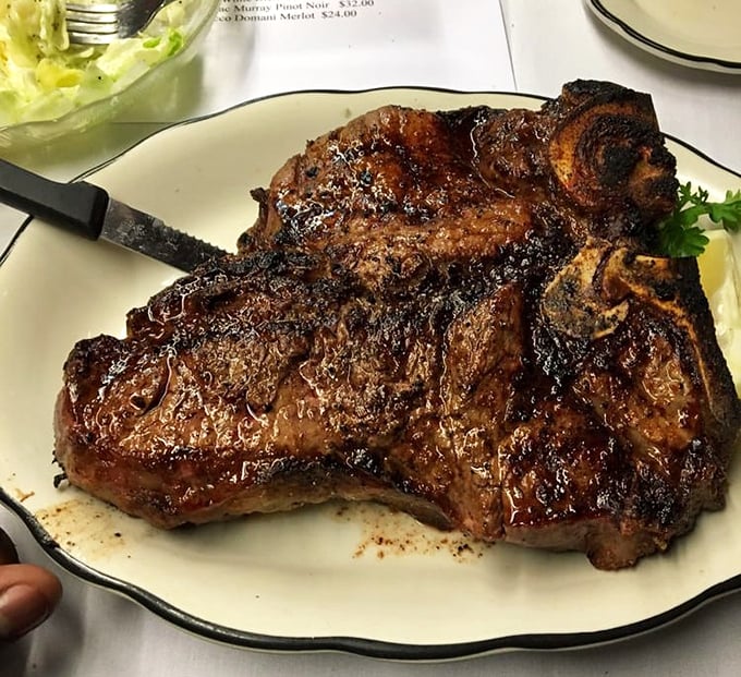 The porterhouse doesn't just occupy the plate &ndash; it conquers it. This isn't dinner; it's a magnificent meat monument that demands respect and elastic waistbands.