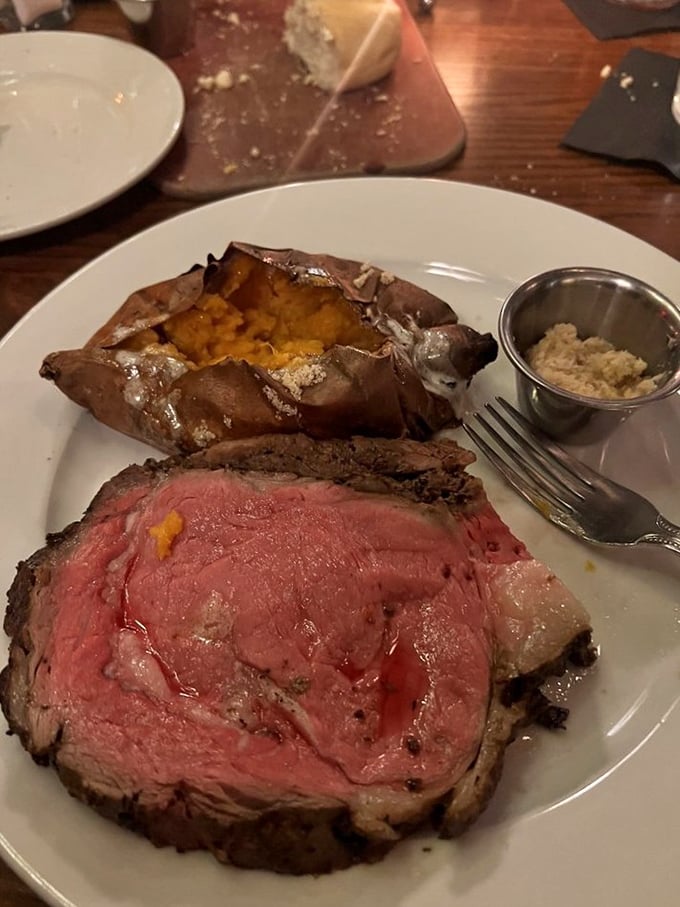 Behold the majesty of properly prepared prime rib&mdash;a monument to patience and precise cooking temperatures. That baked potato looks ready for its close-up too.