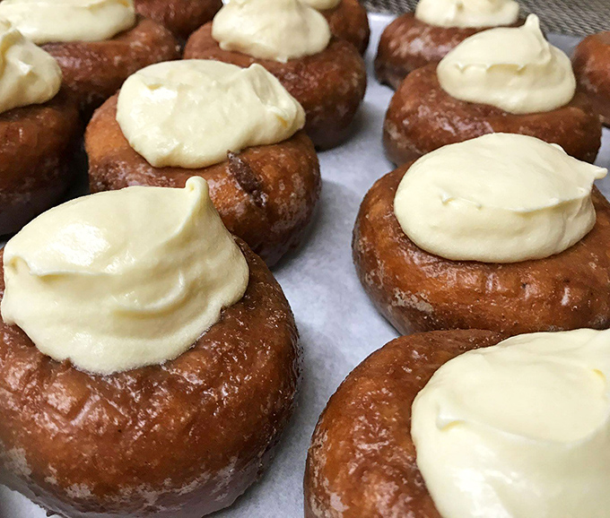 This chocolate-topped masterpiece isn't just a donut; it's therapy in circular form. The generous frosting-to-dough ratio should be studied by mathematicians.