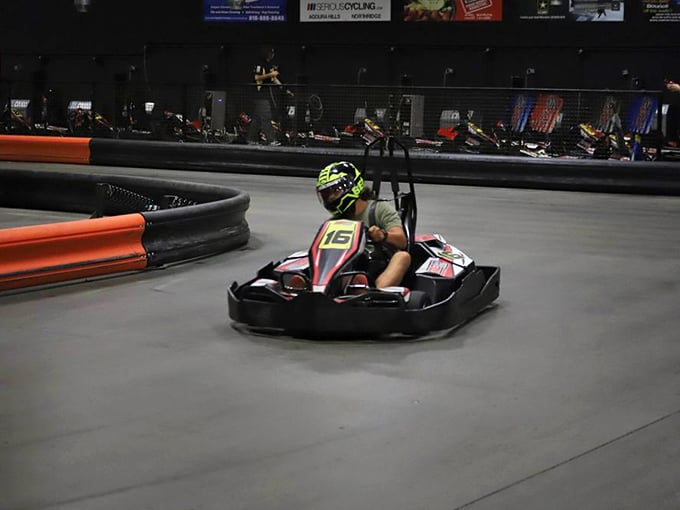 Hunched low like a professional, this racer demonstrates the universal truth: good posture is the enemy of good lap times.
