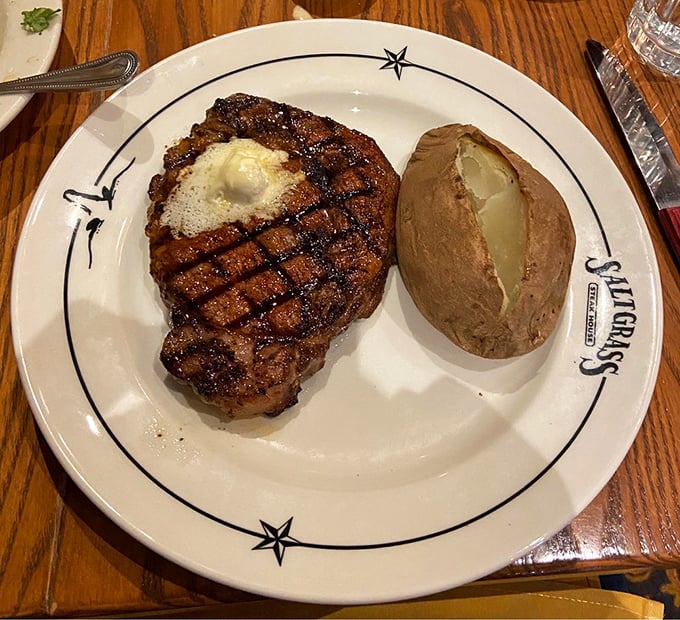 This ribeye with its perfect grill marks and melting pat of butter is what food photographers dream about at night.