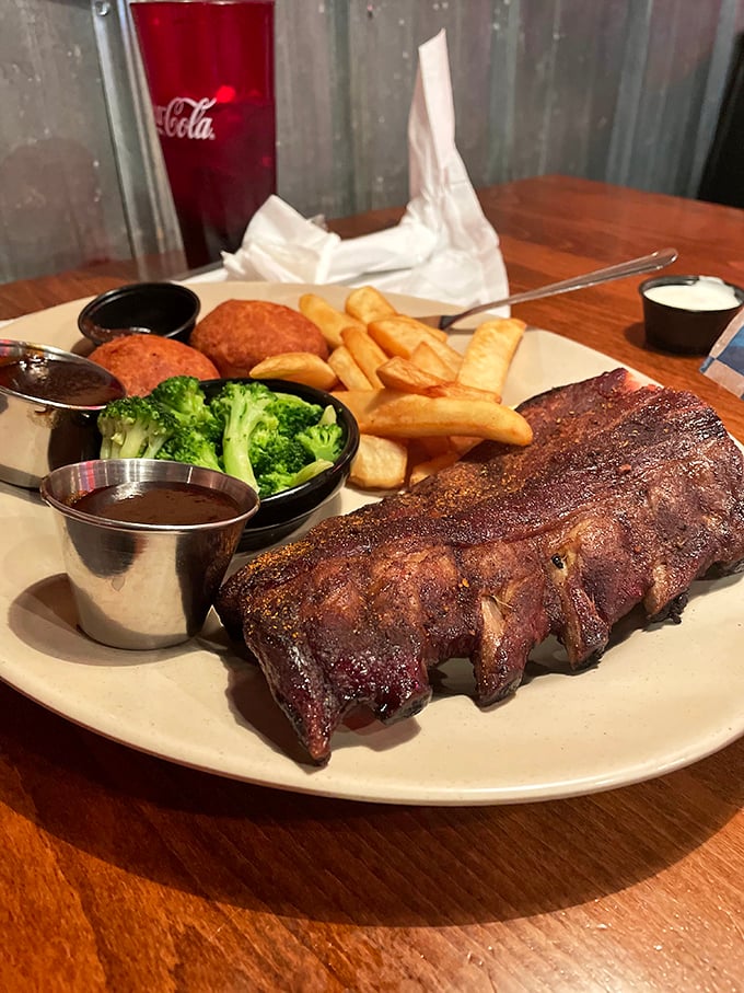 These ribs don't just fall off the bone&mdash;they practically leap onto your fork, bringing friends: broccoli and fries for a balanced adventure.