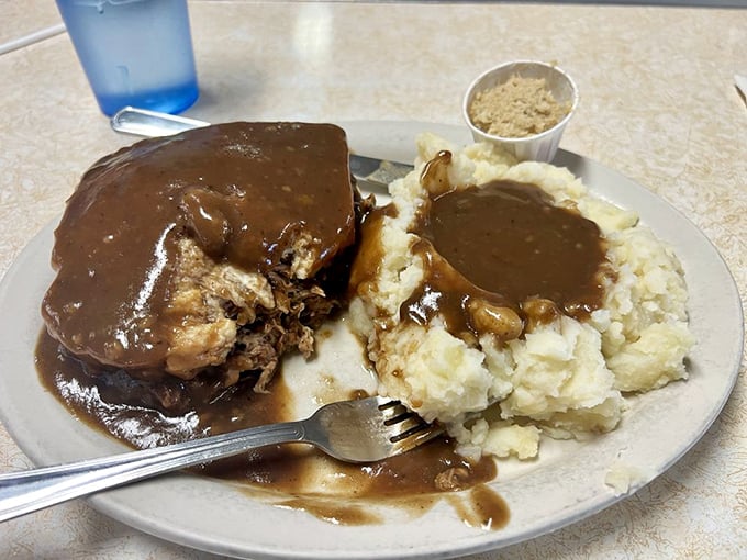The perfect bite of heaven: tender roast beef meets cloud-like mashed potatoes, all unified by gravy that deserves its own fan club.