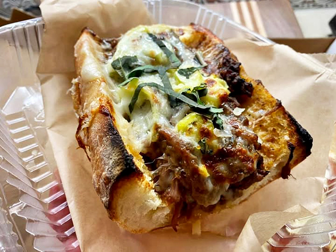 This isn't just lunch, it's an architectural marvel of beef, cheese, and bread. The Italian beef comes wrapped like a present your taste buds can't wait to unwrap.