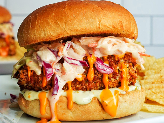 Not just a sandwich, but an architectural masterpiece of crispy, saucy indulgence that demands both hands and possibly a crowd's applause.