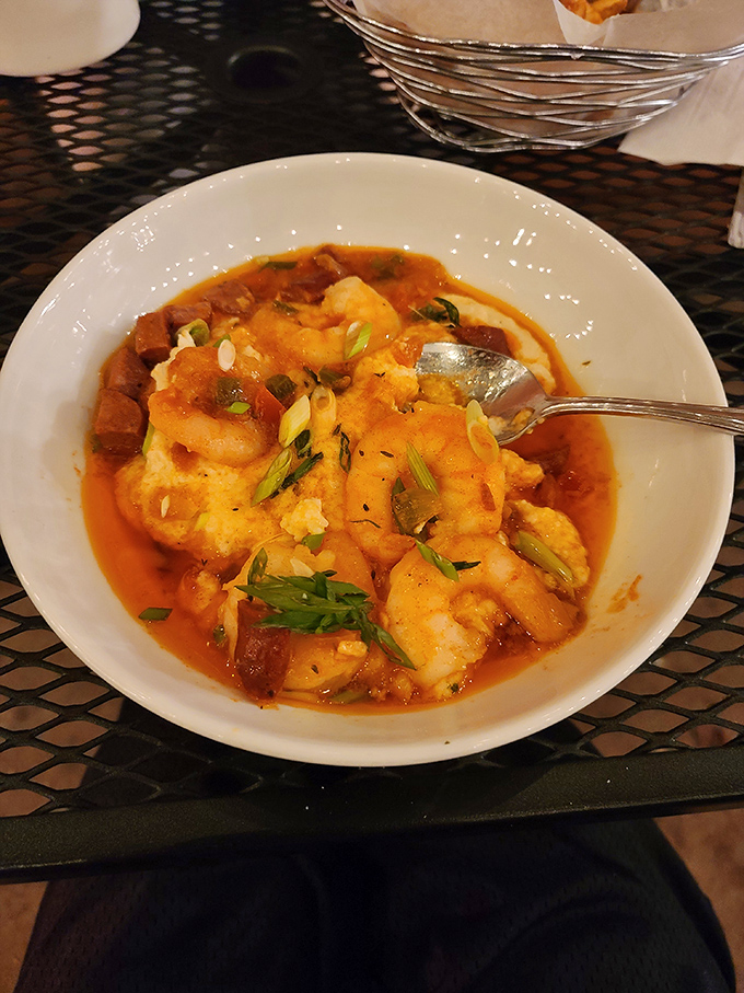 These aren't your average shrimp and grits. This bowl transforms humble corn into a throne for perfectly cooked crustaceans swimming in flavor-packed glory.