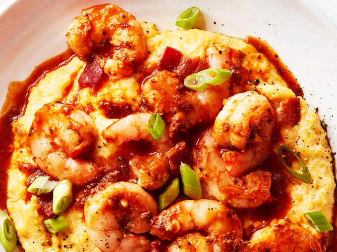 Plump shrimp nestled on creamy grits with a sauce so good you'll contemplate drinking it directly—no judgment here.