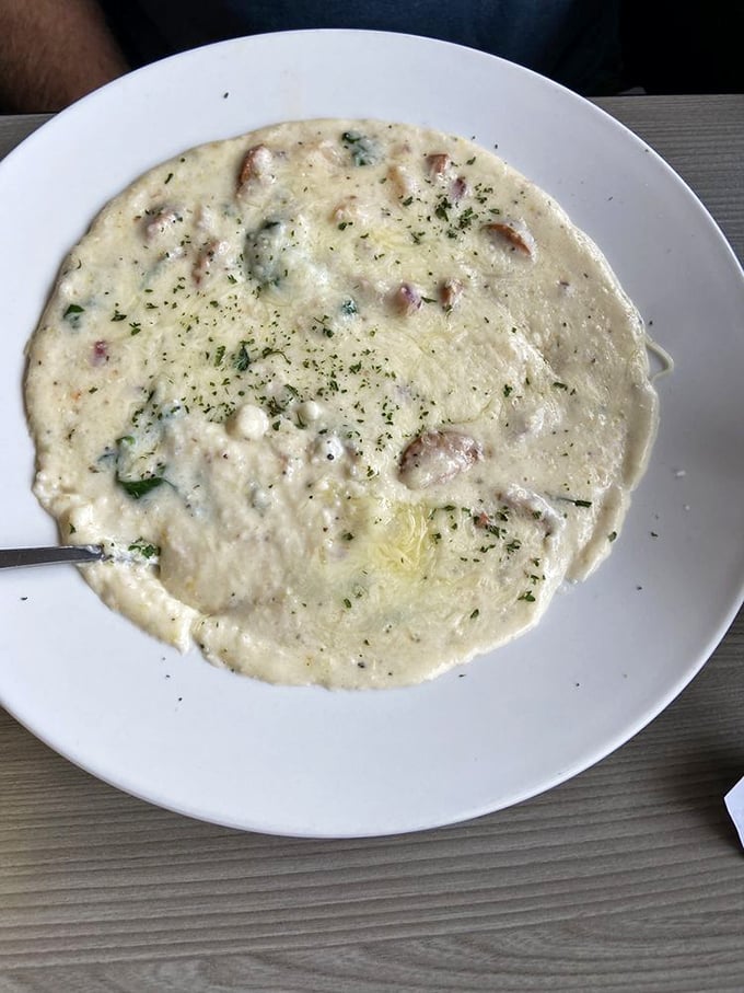 Another variation on their signature dish - these grits cradle tender shrimp and savory bits like a culinary lullaby that soothes the soul.