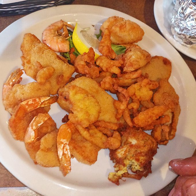 Golden-fried shrimp and fish nestled together like old friends at a reunion&mdash;crispy, succulent, and worth every napkin you'll need.