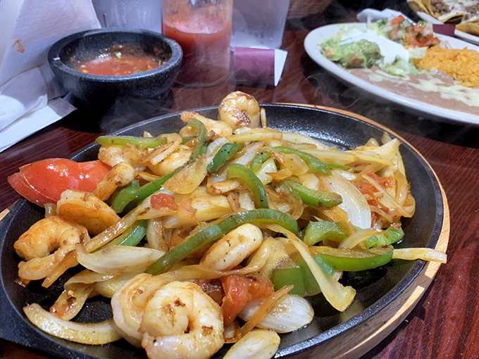 These shrimp fajitas aren't just food; they're a performance art piece where caramelized onions and peppers play supporting roles to perfectly seasoned seafood.
