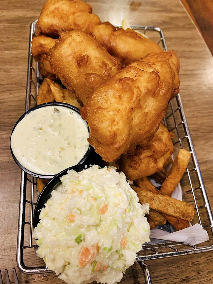 The holy trinity of seafood perfection: impossibly crisp fish, hand-cut fries, and two dipping sauces. Simplicity that would make a New England fisherman weep with joy.