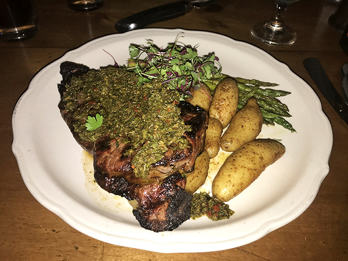 Herb-crusted perfection meets fingerling potatoes in a plate that whispers, "Yes, you deserve this." The microgreens add both color and conscience.