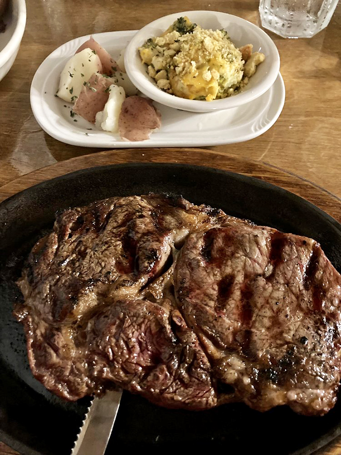 This isn't just steak&mdash;it's a masterpiece of meat artistry served alongside what appears to be the world's most comforting corn casserole.
