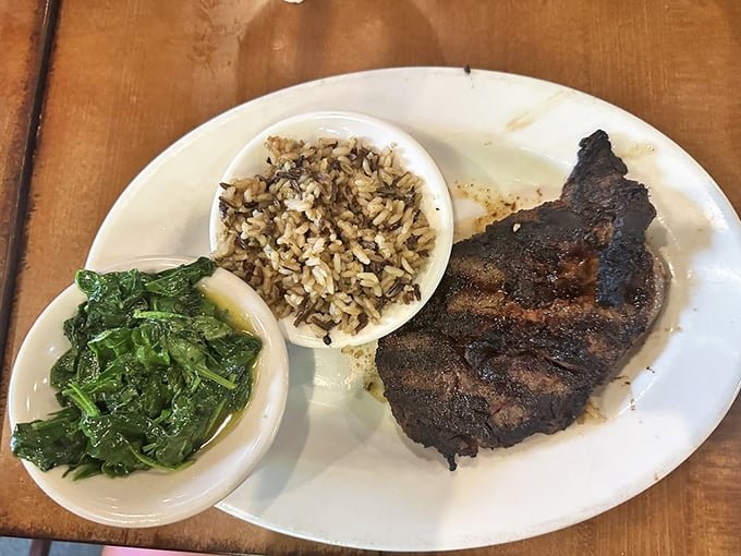 Proof that a great steakhouse respects the sides as much as the main event. That wild rice and vibrant spinach aren't just accessories&mdash;they're accomplices.