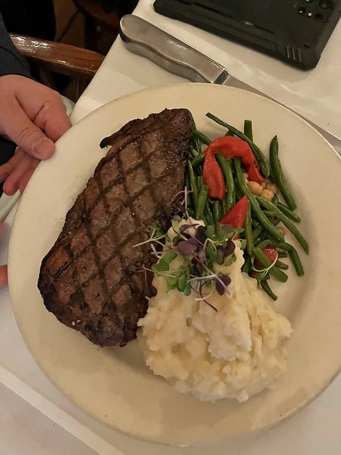 Diamond-patterned grill marks aren't just for show—they're evidence of a kitchen that understands the sacred relationship between beef, fire, and a hungry diner.