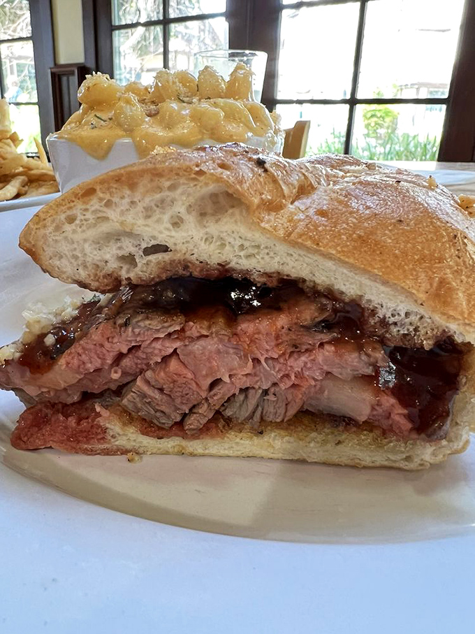 The cross-section tells the whole story: perfectly pink tri-tip, piled generously on fresh bread with just enough sauce to make you smile.