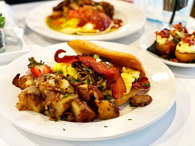 The breakfast sandwich reimagined. Eggs, potatoes, and bacon nestled together like old friends catching up after too long apart.