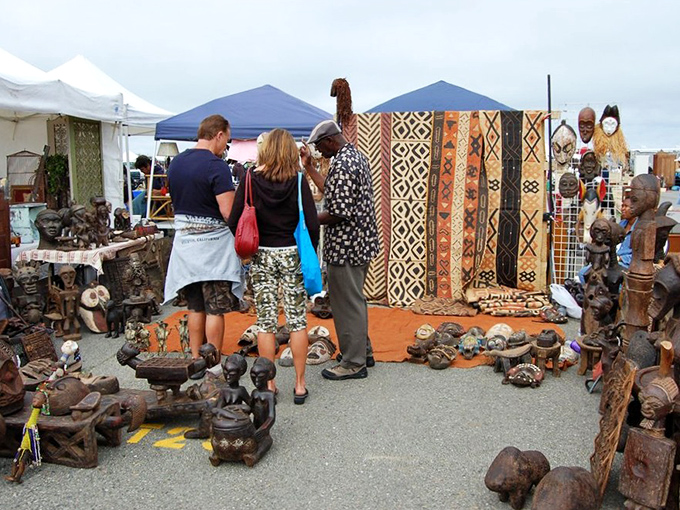African art and textiles create a cultural oasis amid the market bustle. Those wooden sculptures have traveled farther than most of us ever will!