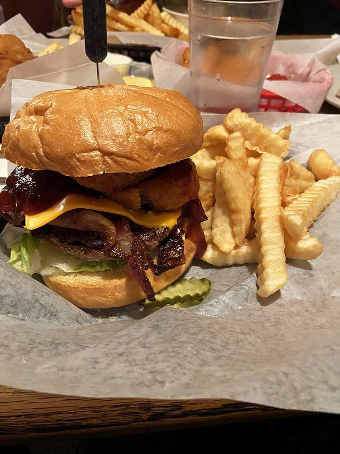 Behold the Western BBQ burger – architectural perfection with a proper meat-to-bun ratio and fries that understand their supporting role.