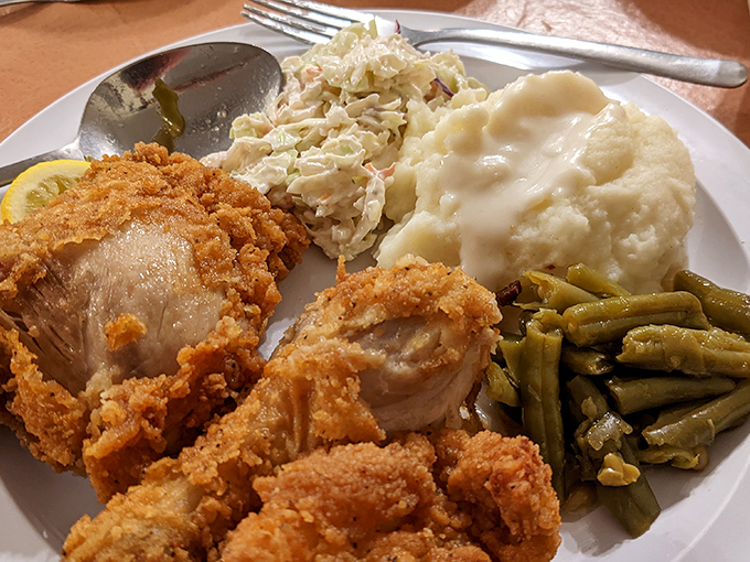 The holy trinity of Southern comfort: crispy fried chicken, creamy mashed potatoes, and green beans that taste like summer in Arkansas.