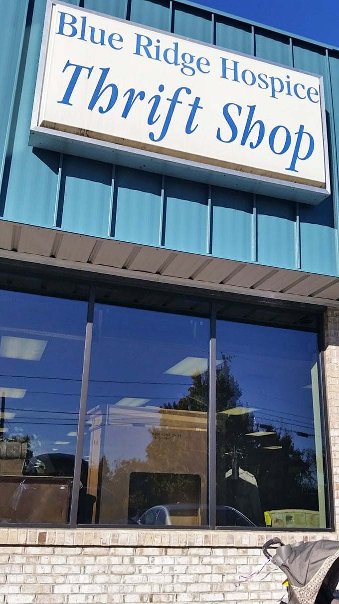 Blue Ridge Hospice Thrift's azure signage stands out like a beacon for bargain hunters with big hearts and empty trunks.