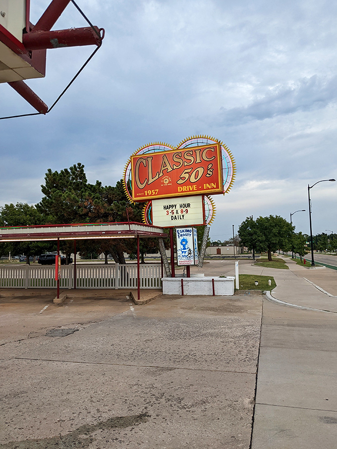 Neon nostalgia! Classic 50's Drive-In's vintage sign stands like a beacon for time travelers seeking the perfect hot dog experience.