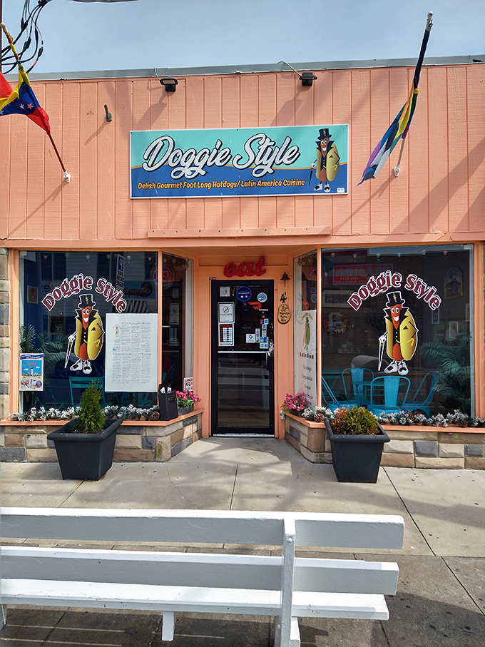 Doggie Style's cheerful coral exterior stands out like a delicious beacon. Latin American flair meets beachside charm.