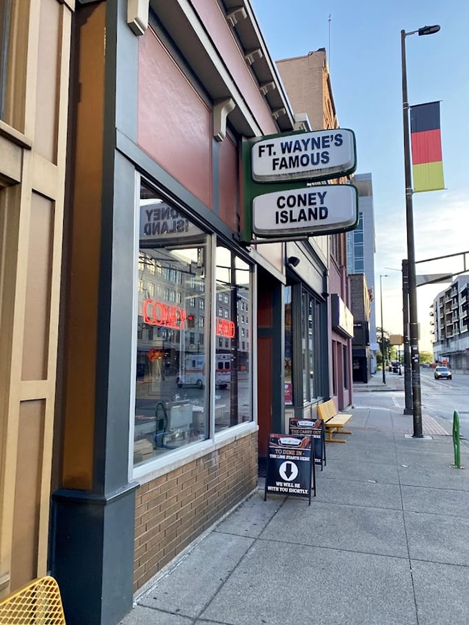 That simple sidewalk sign beckons passersby into Fort Wayne's Famous Coney Island &ndash; where generations have experienced hot dog bliss.