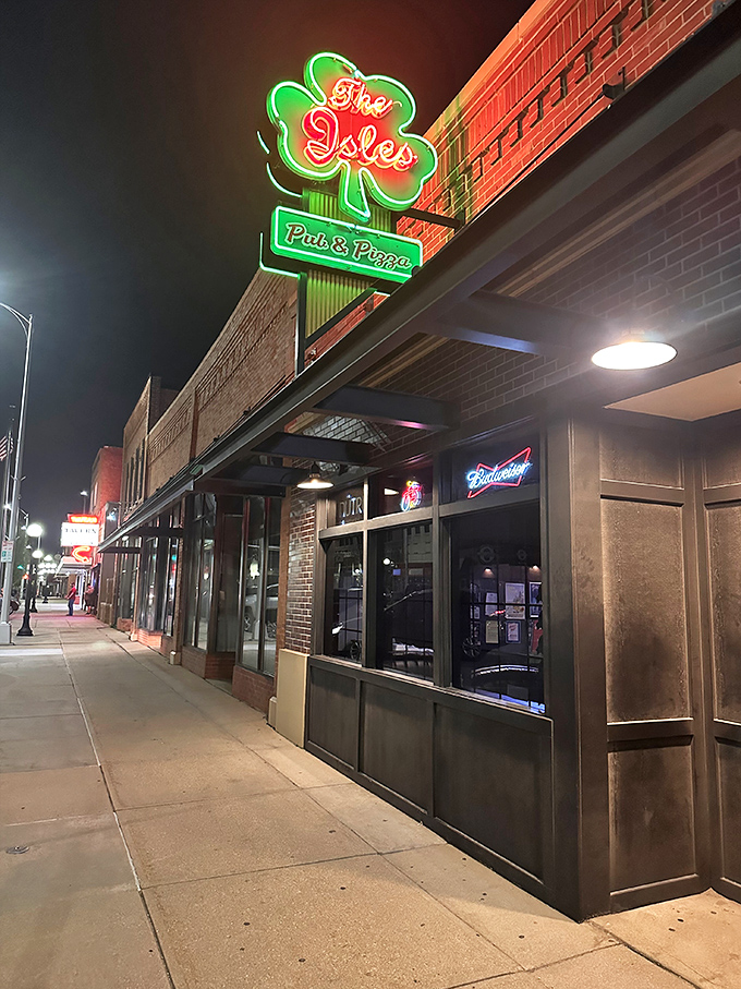 Isles Pub & Pizza (exterior): "Where the luck of the Irish meets the glory of perfect pizza. This shamrock sign points to flavor gold."