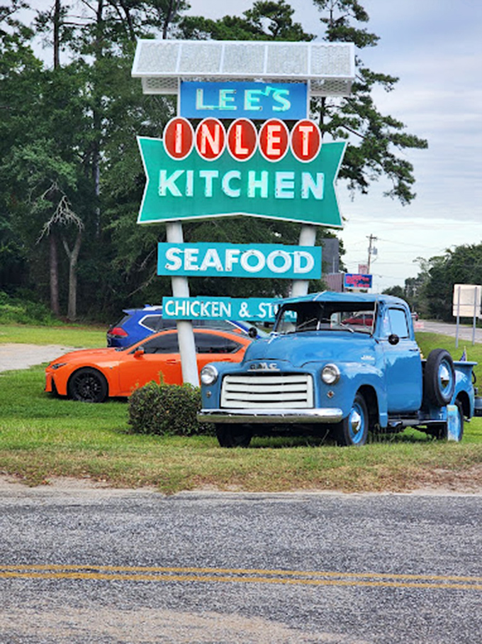 That vintage roadside sign is like a beacon for hungry travelers. Lee's Inlet Kitchen's blue truck could be in a Norman Rockwell painting!