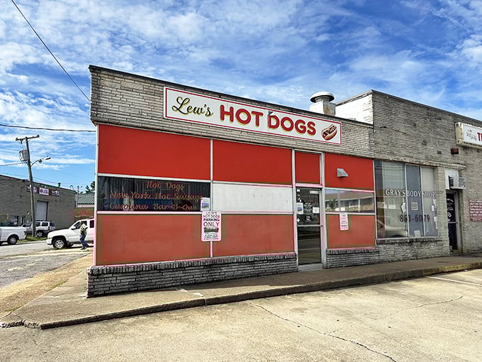 Lew's bold red-and-white facade stands like a hot dog lighthouse, guiding hungry sailors through Norfolk's culinary waters.