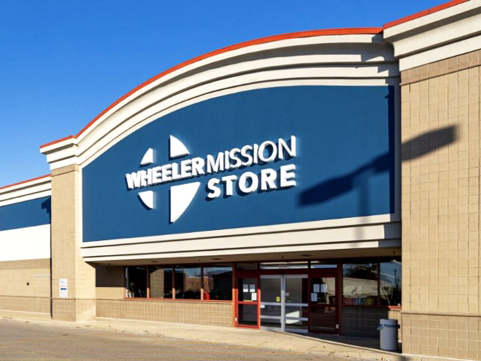 Wheeler Mission Store's sleek signage promises organized treasure hunting without the usual thrift store obstacle course.