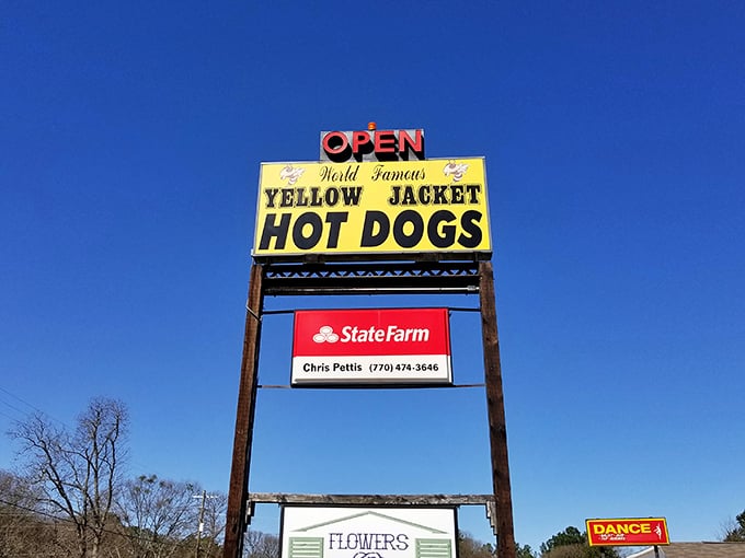 Yellow Jacket's towering sign stands like a beacon of hope for hungry travelers&mdash;a promise of delicious respite amidst life's journey.