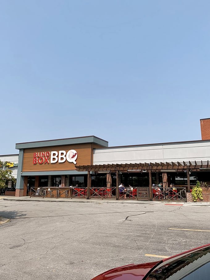 Blind Box BBQ: "Red metal building, white buckets outside. Don't let the simple exterior fool you&mdash;inside is a smoky meat paradise."