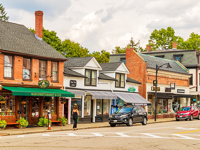 White colonial architecture in Concord stands proud against blue skies, looking much as it did when Thoreau wandered these streets.
