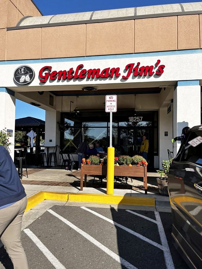 The daytime view reveals a neighborhood institution where little league teams and grandparents have been celebrating with cheese pulls since the '70s.