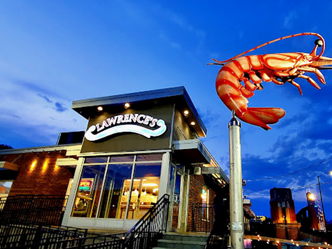 As night falls, Lawrence's neon glow becomes a lighthouse for hungry souls seeking fried perfection at any hour.