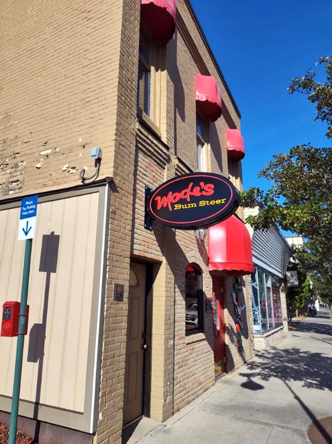 That cheeky red awning and brick facade? Pure Michigan charm housing some seriously sophisticated steak skills.